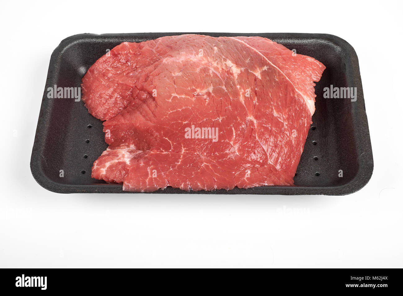 fresh raw beef in a package isolated on white background Stock Photo ...