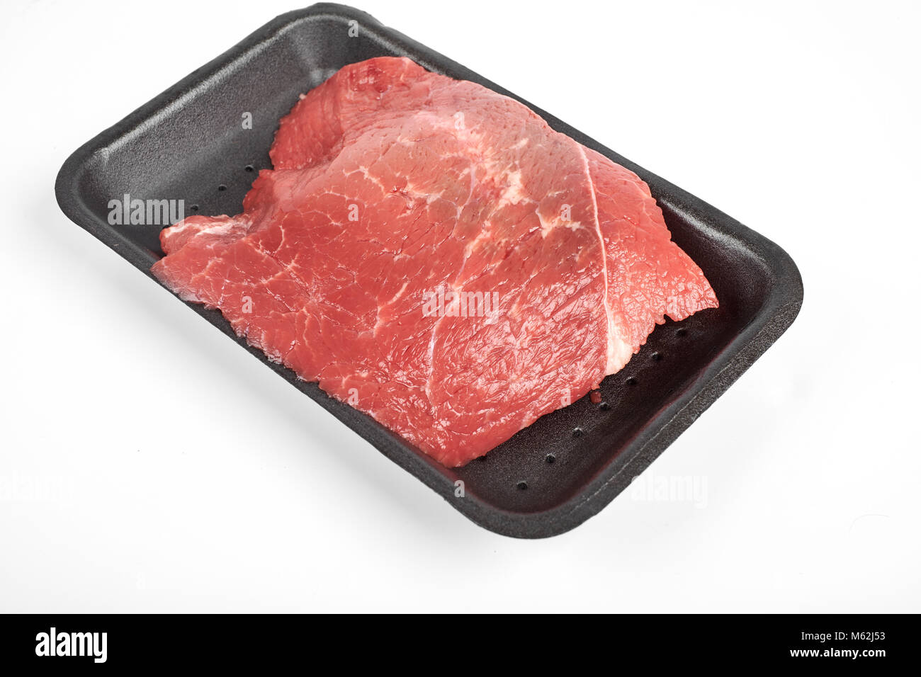 fresh raw beef in a package isolated on white background Stock Photo ...
