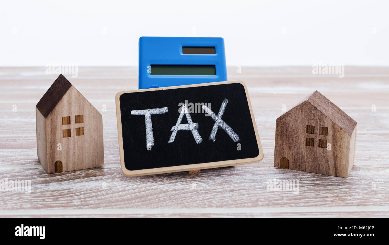 Property tax concept with tax sign on calculator Stock Photo - Alamy