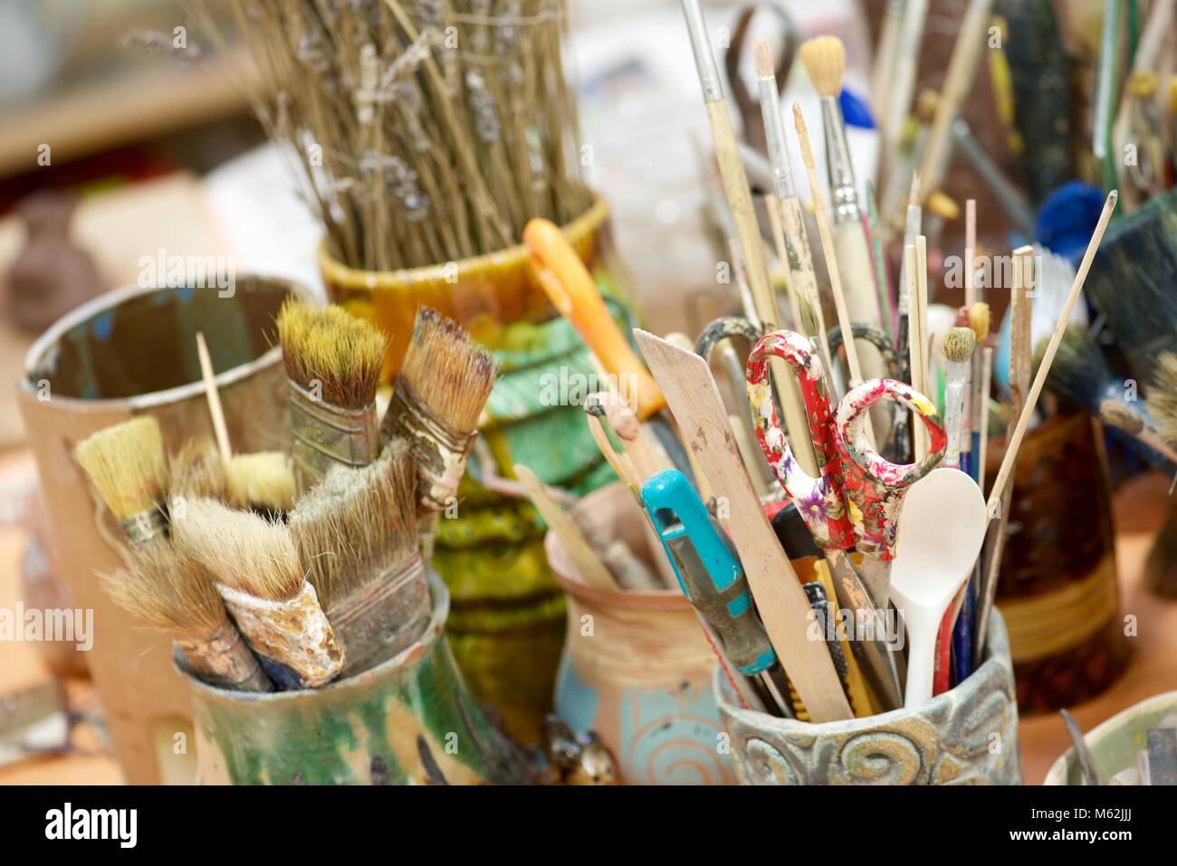Group of brushes and tools n an artist's workshop Stock Photo - Alamy