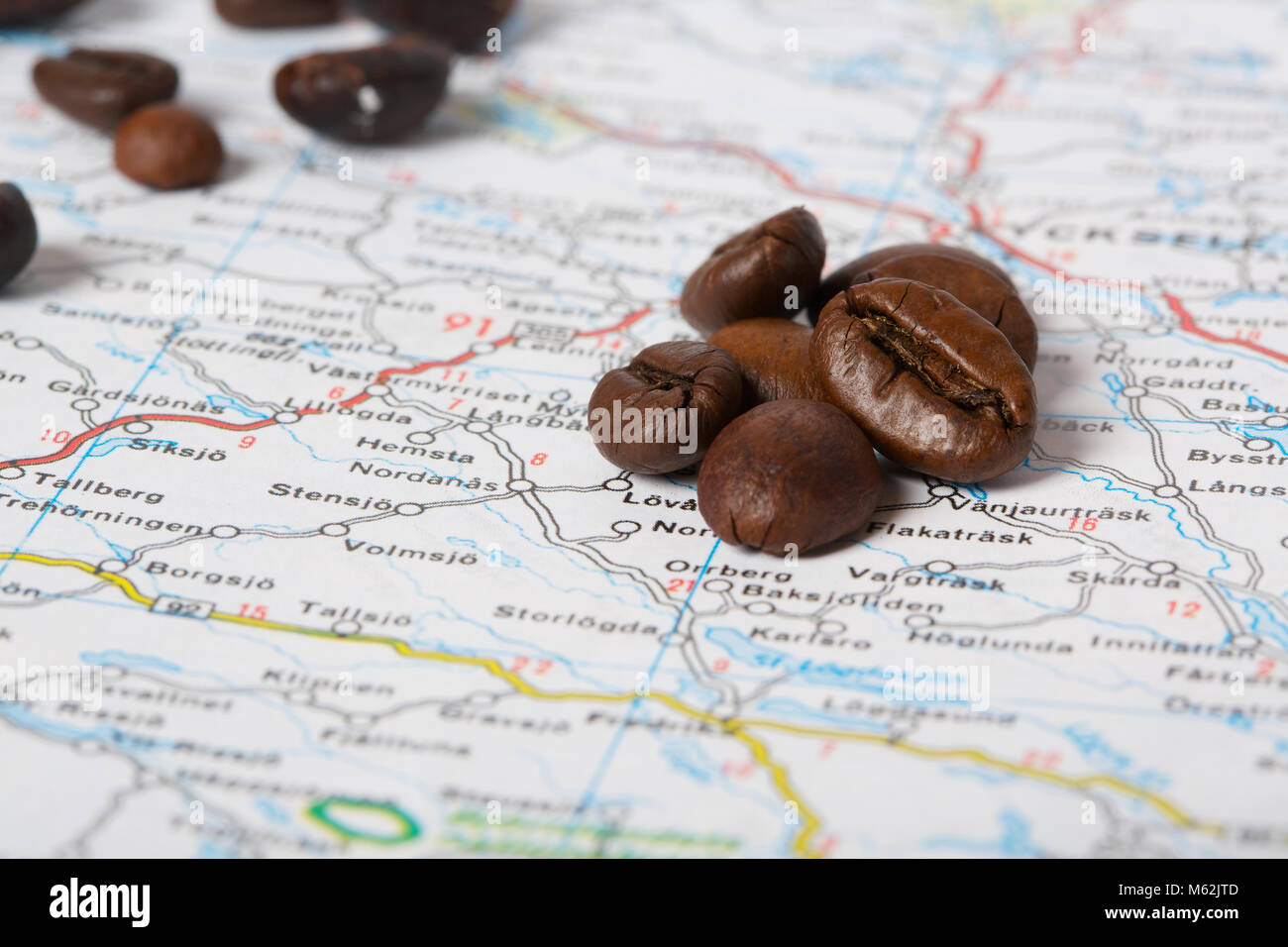 Coffee beans on a map. Closeup Stock Photo - Alamy