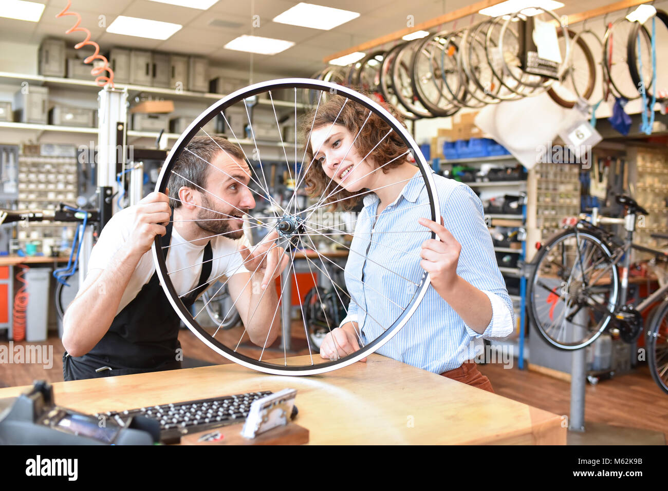 customer and dealer in bicycle shop - purchase and repair of bicycles ...