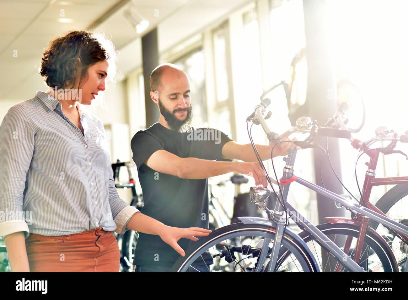 Bicycle shop consulting - salesman and customer in conversation Stock ...