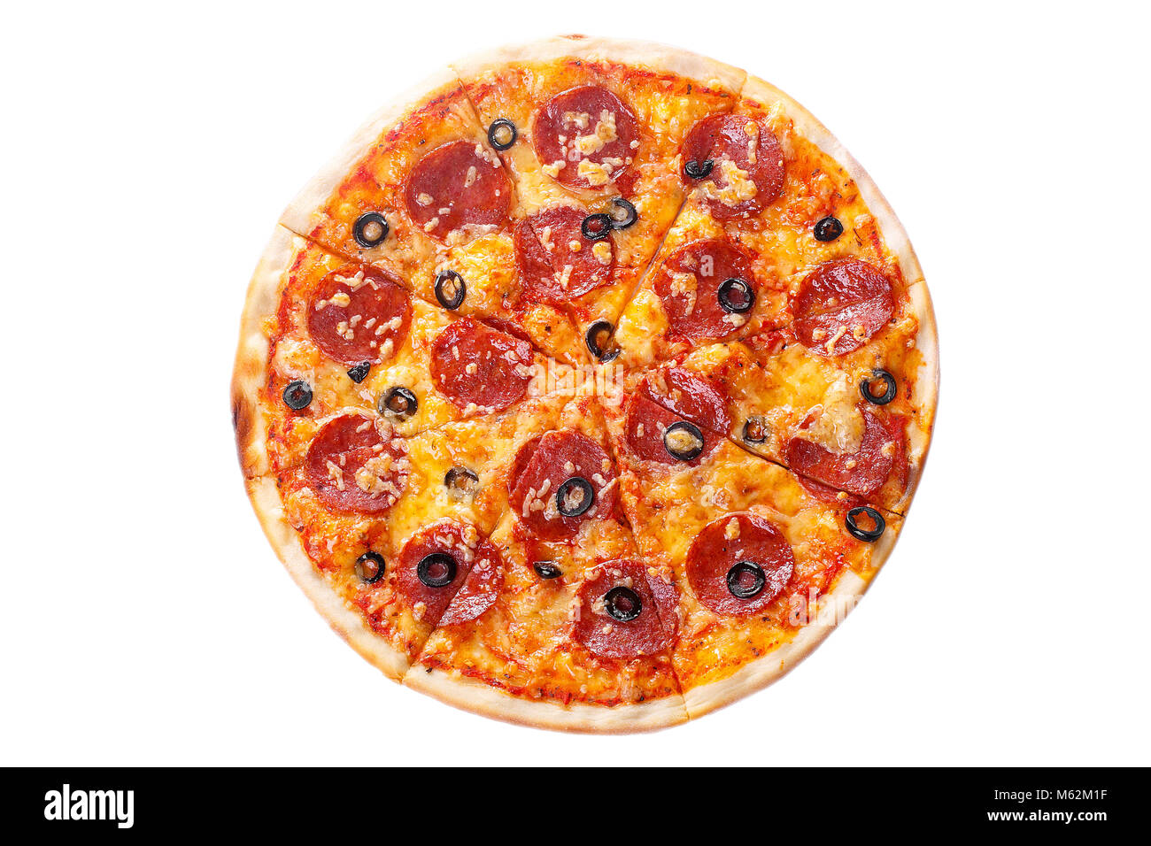 Pizza whole round, cut into pieces, on a white isolated background ...