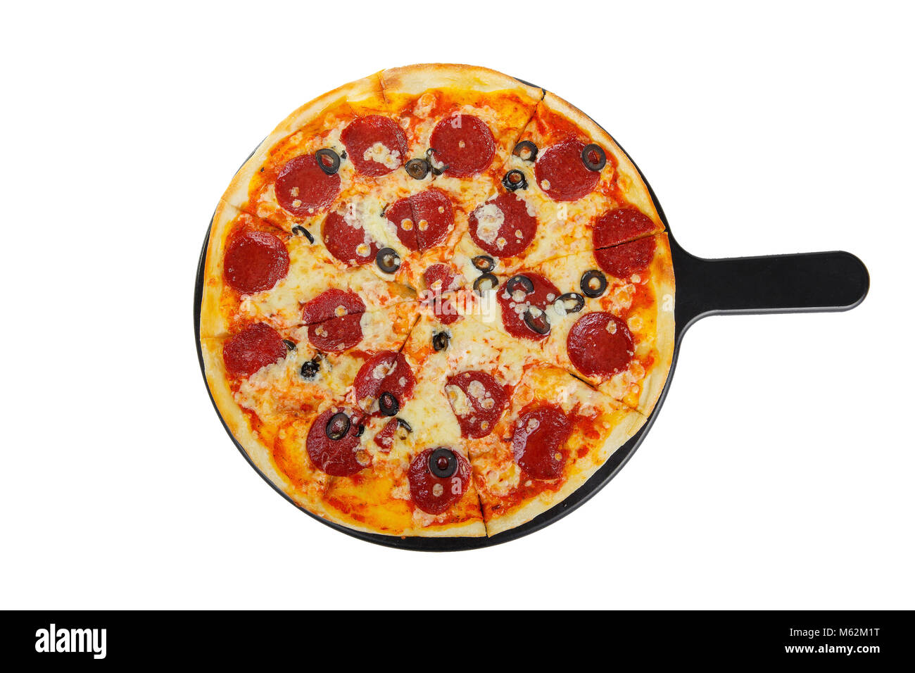 Pizza whole round on a black tray, blackboard, cut into pieces, on a ...