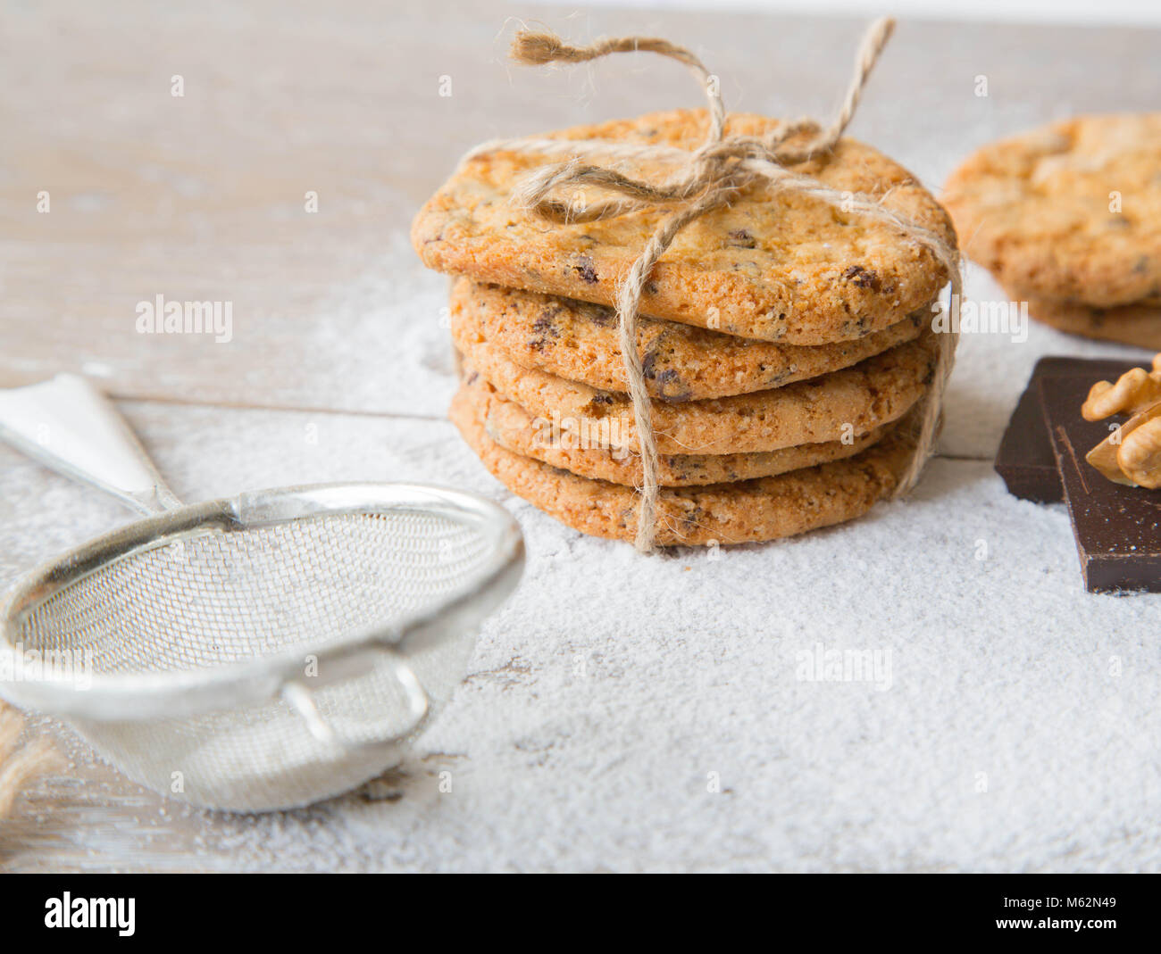 Five biscuits with wallnuts and chocolate chips bound with pack thread ...
