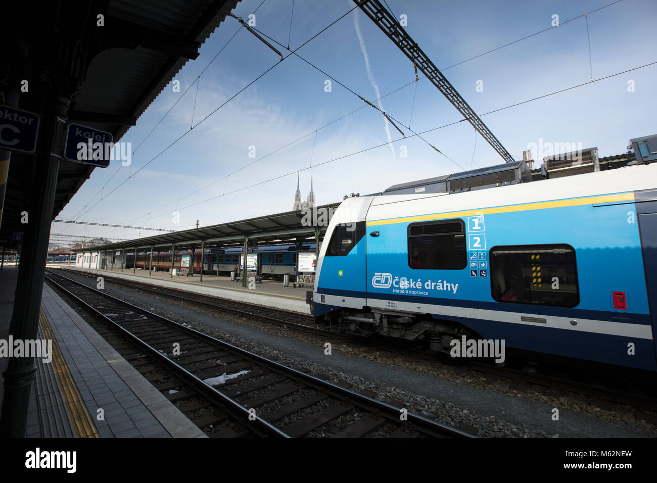 A train with Brno cathedral in the background at Brno Station, Czech ...