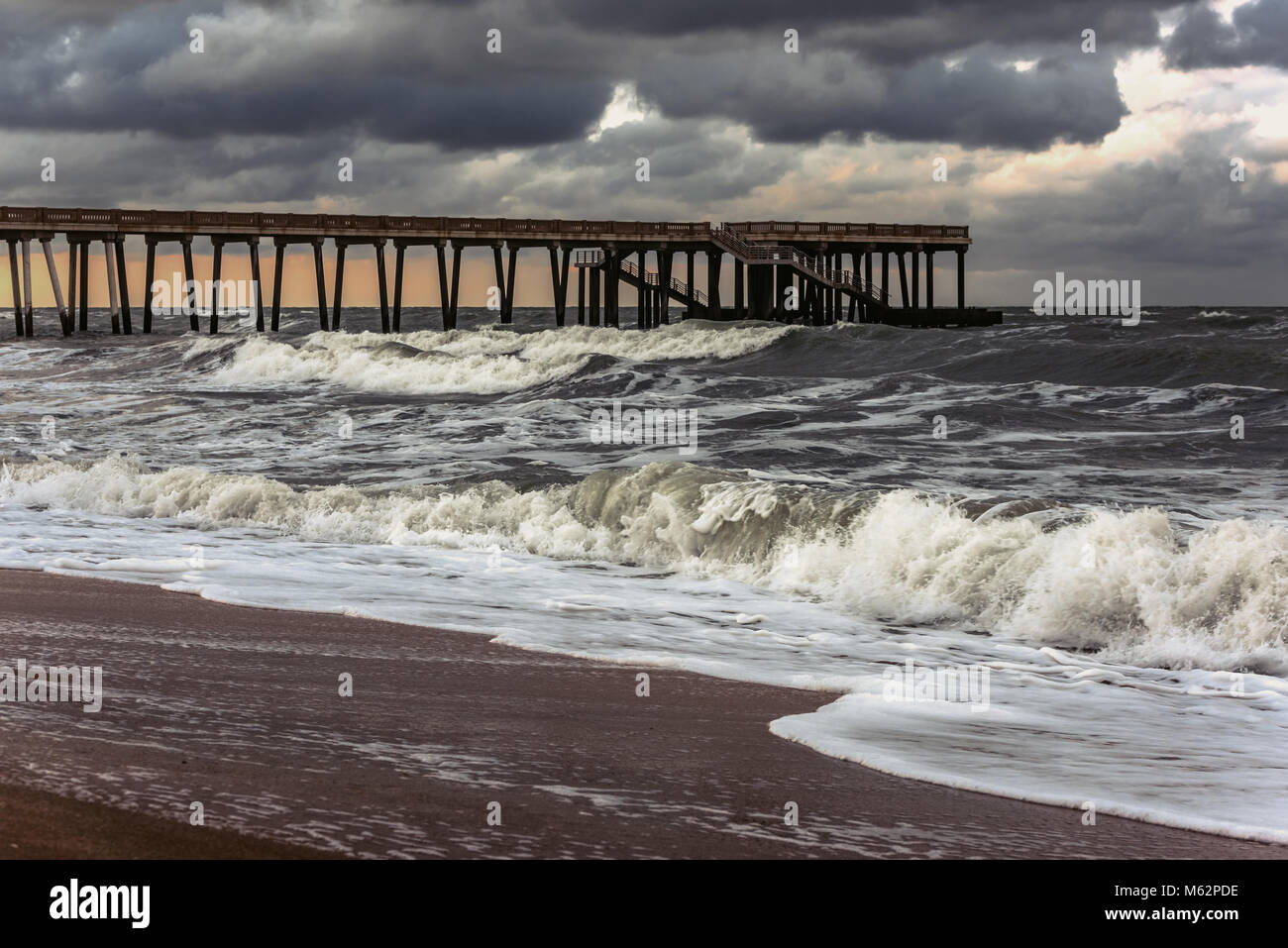 Sea pier in a storm Stock Photo - Alamy