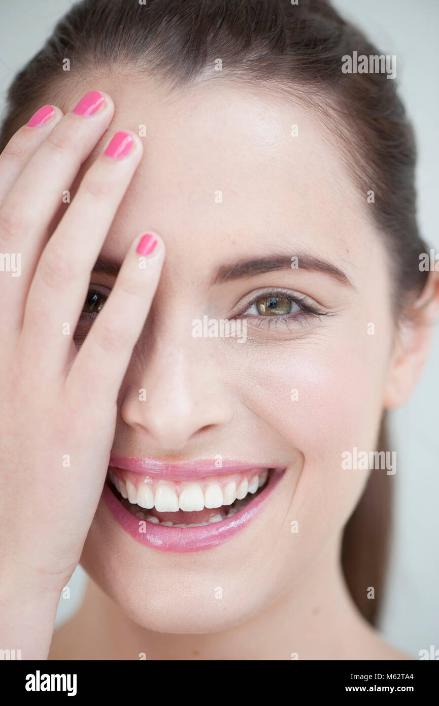 Beautiful woman touching face hi-res stock photography and images - Alamy