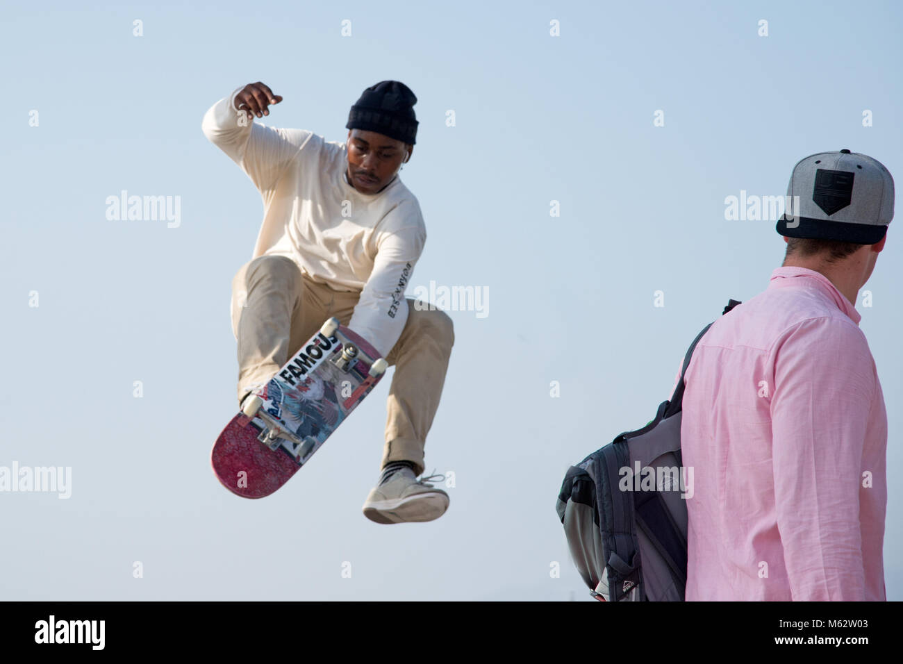 Filming a skateboarder performing tricks at Venice Beach Skatepark ...