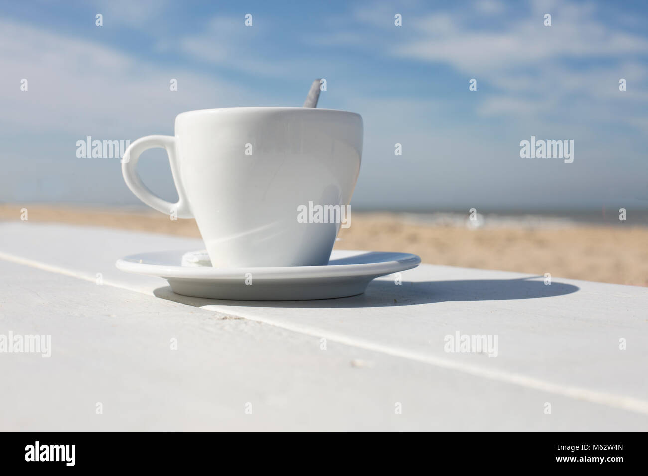 white coffee cup with ocean , beach and seascape. Shallow dof Stock ...