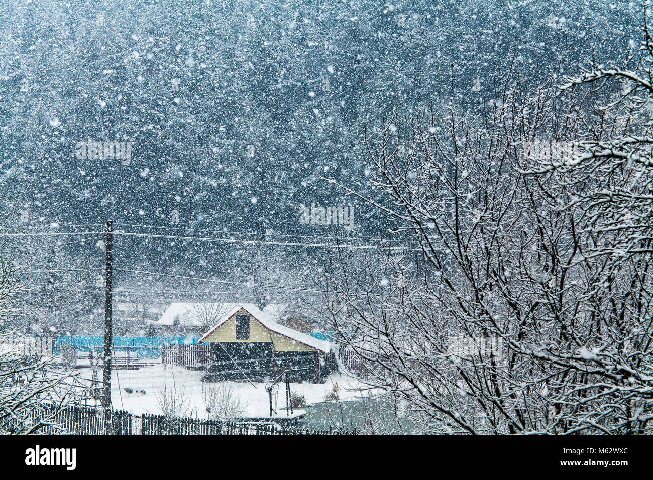 scene of heavy snowing in the village, Romania Stock Photo - Alamy