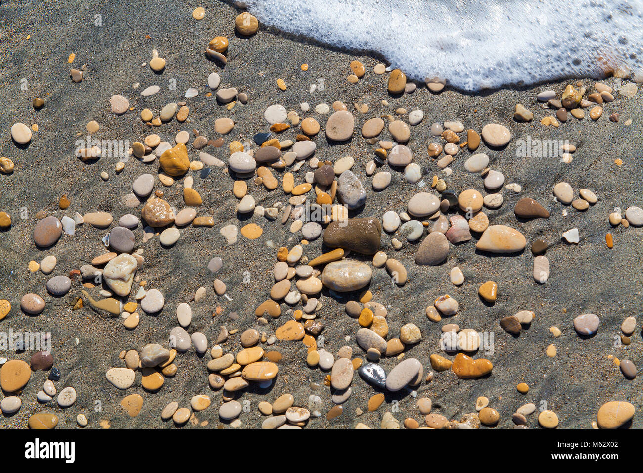 beautiful round stones on the beach Stock Photo - Alamy