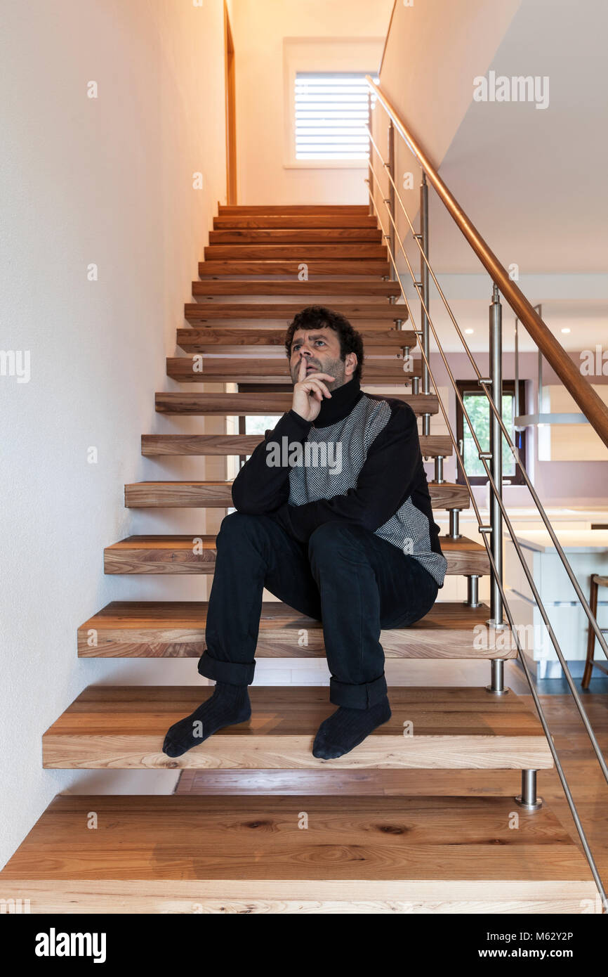 Person on stairs apartment hi-res stock photography and images - Alamy