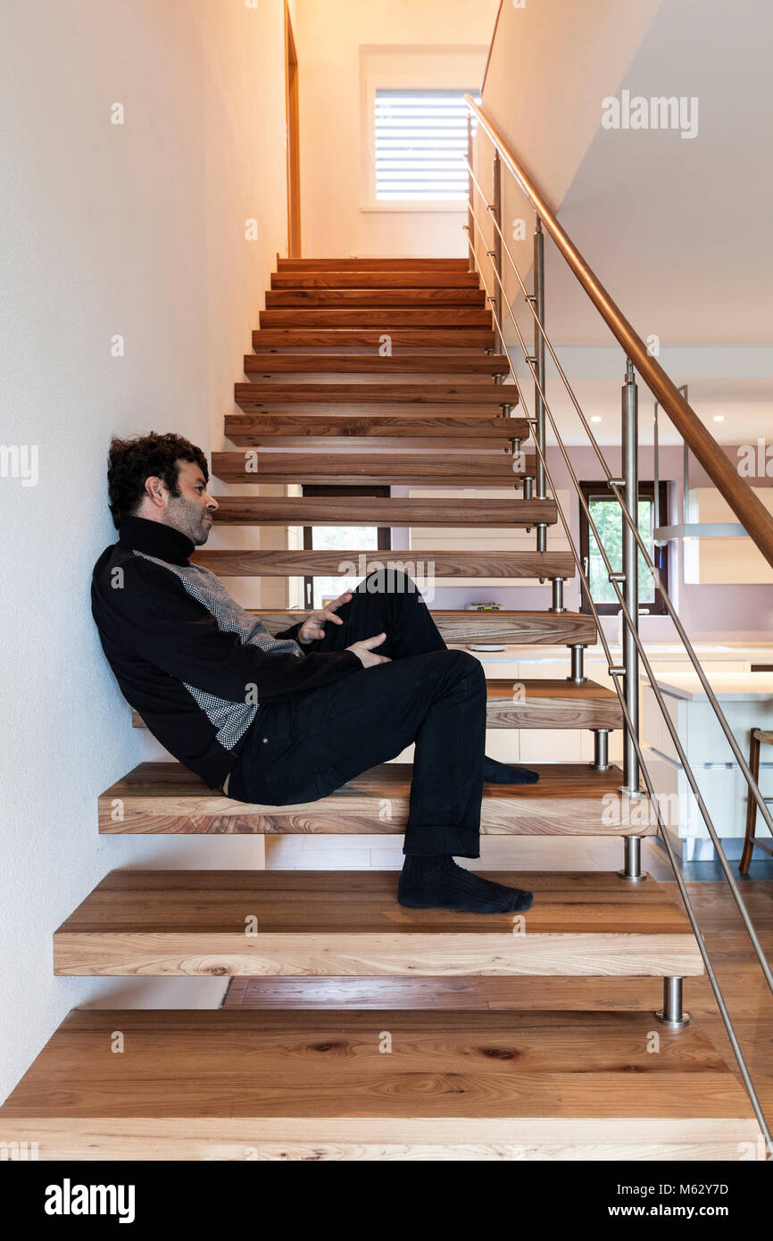 Person on stairs apartment hi-res stock photography and images - Alamy