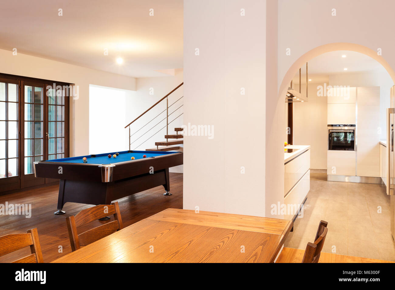 modern loft, view of a large room from the table Stock Photo - Alamy