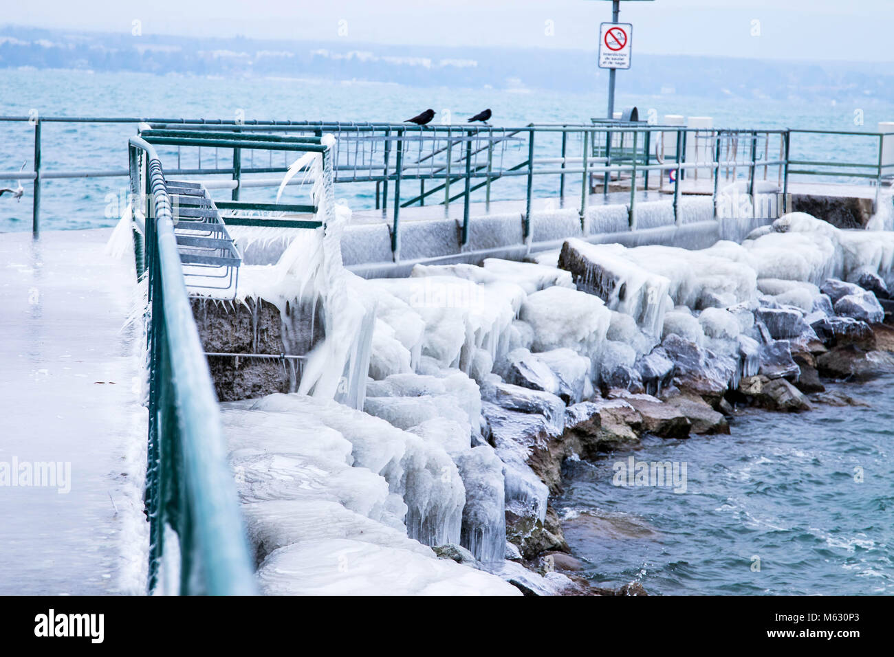 frozen dock covered by ice winter storm Stock Photo - Alamy