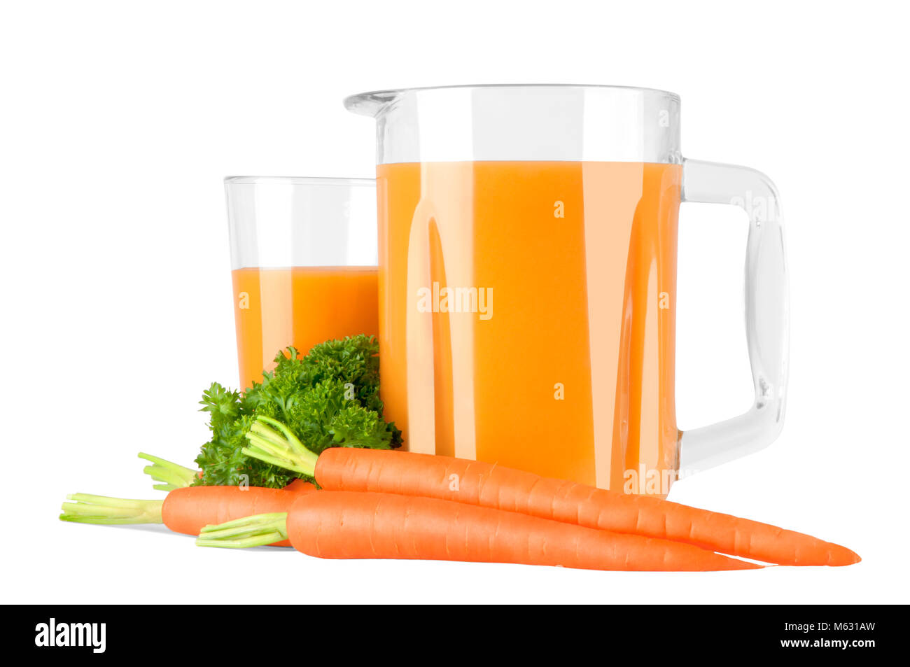 Glass pitcher with carrot juice and fresh carrot Stock Photo - Alamy
