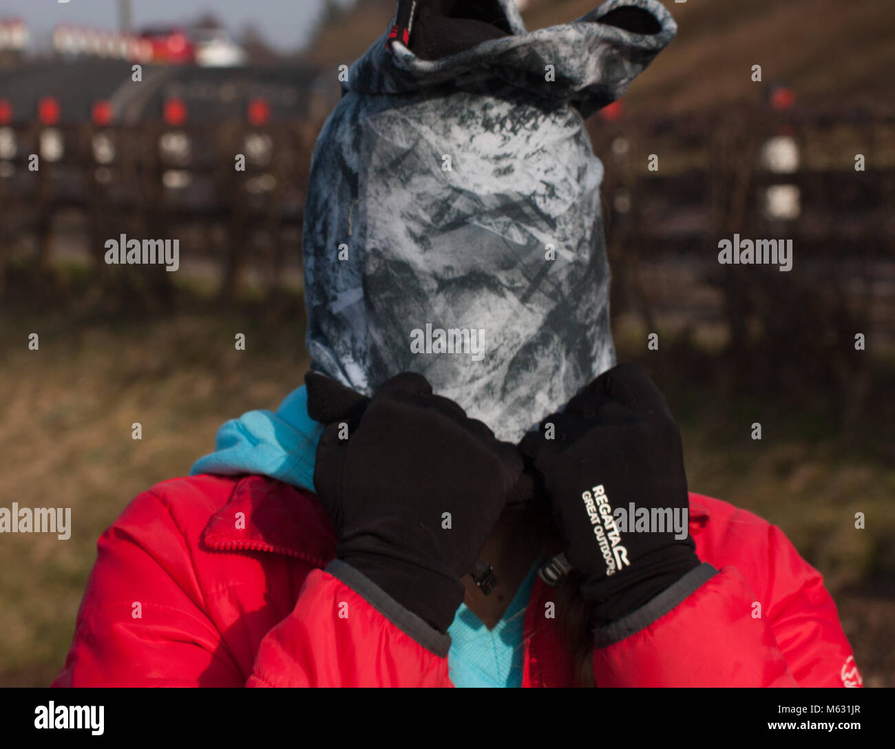 Pulling buff over face hi-res stock photography and images - Alamy