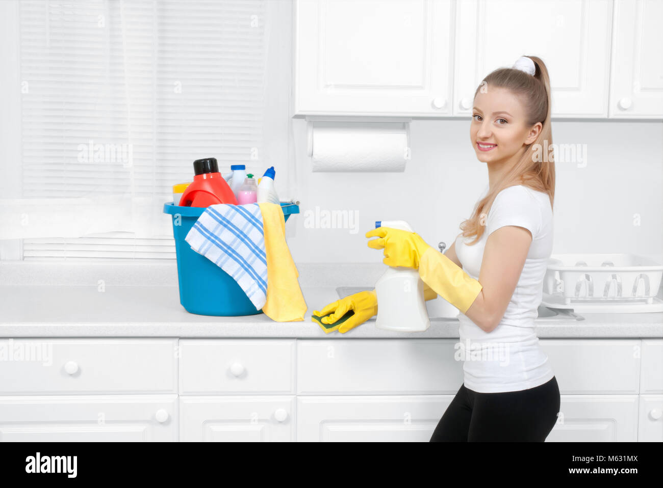 Cleaning service, woman do clean kitchen with cleaning supplies Stock ...
