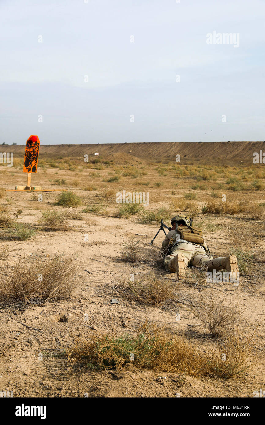 An Iraqi security forces member engages a target during a live fire ...