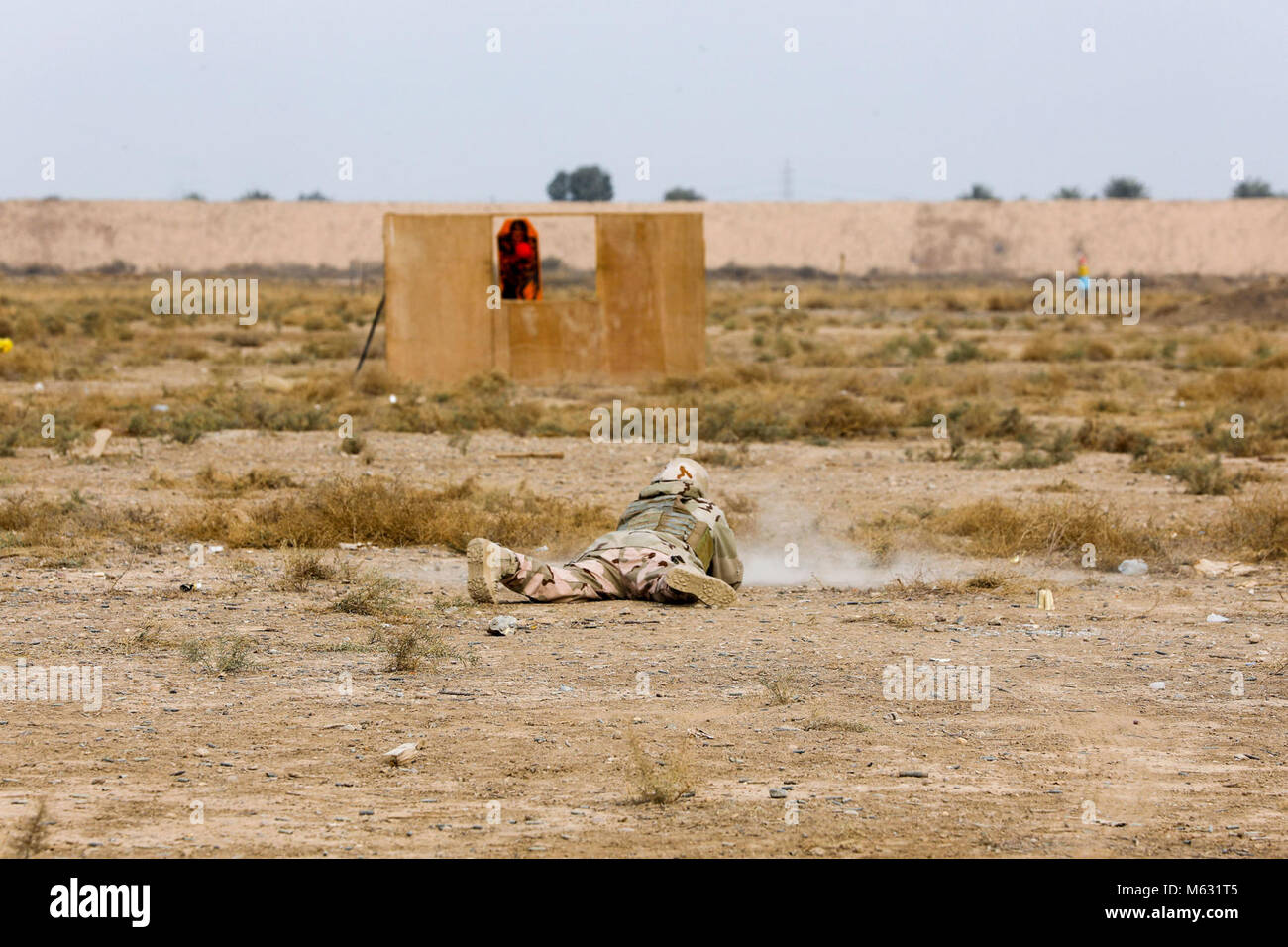 An Iraqi security forces member engages a target during a live fire ...