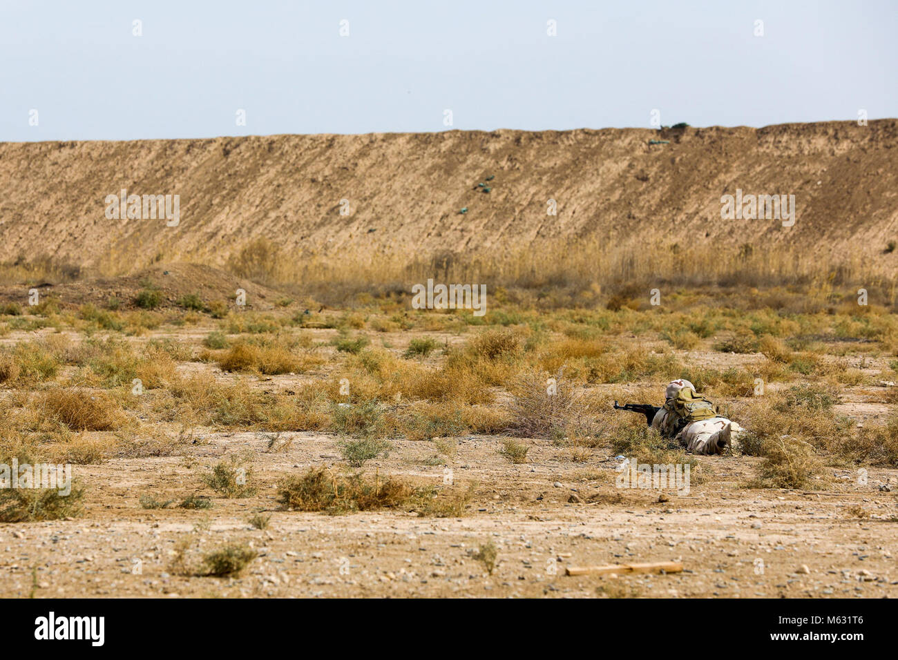 An Iraqi security forces member engages a target during a live fire ...