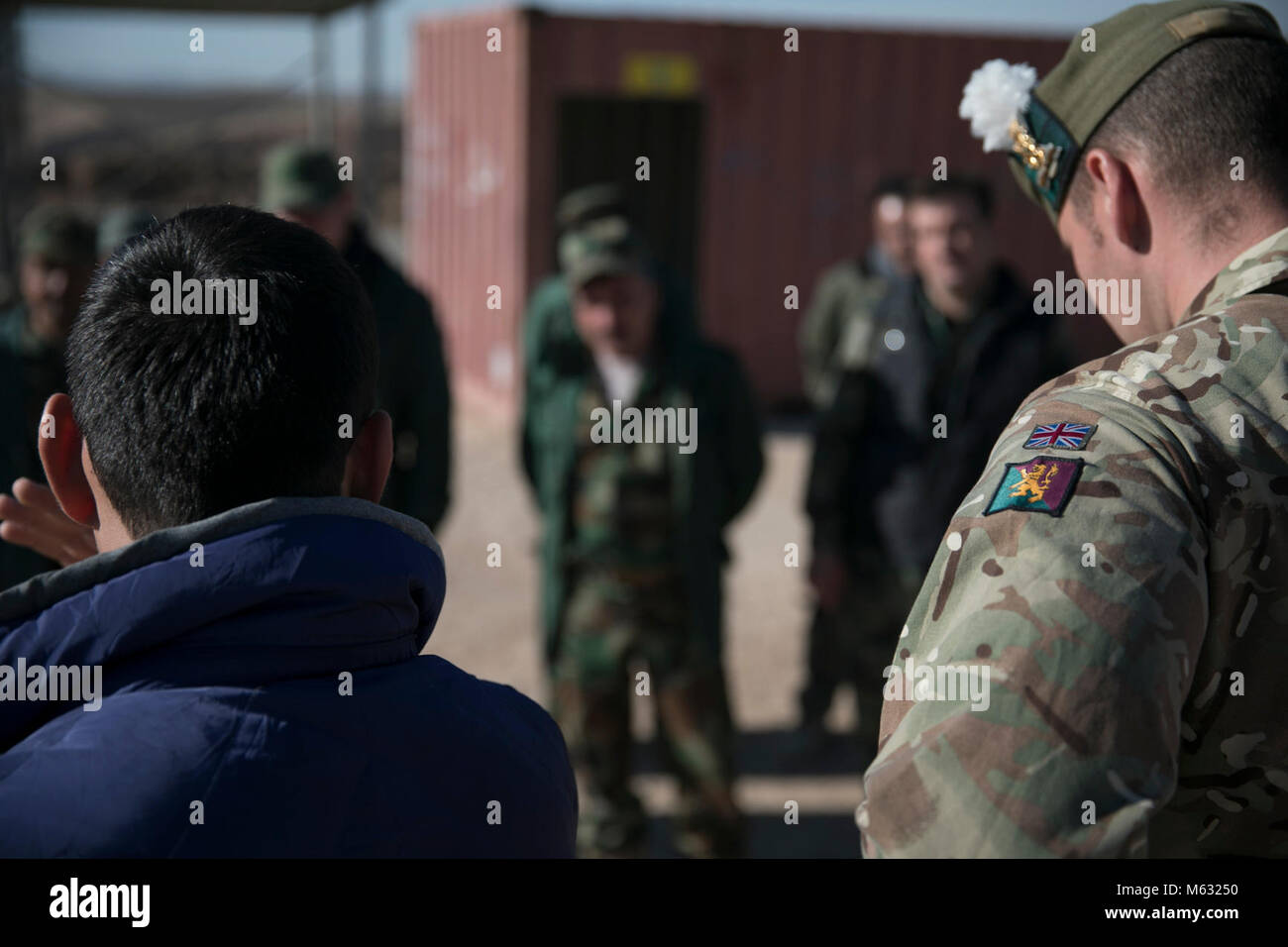 A member of the British training team instructs security force members ...
