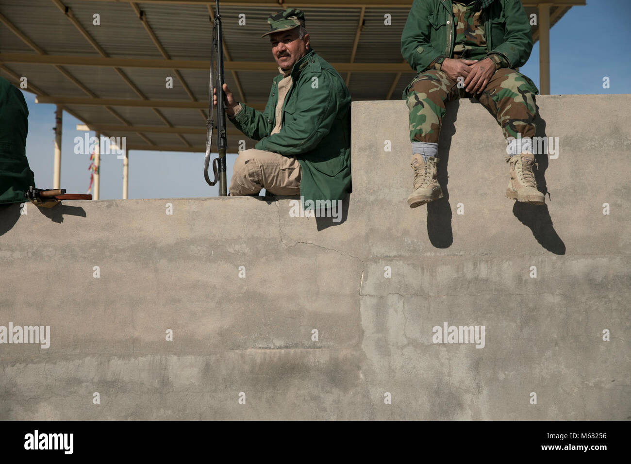 Security force members observes a training exercise while learning ...