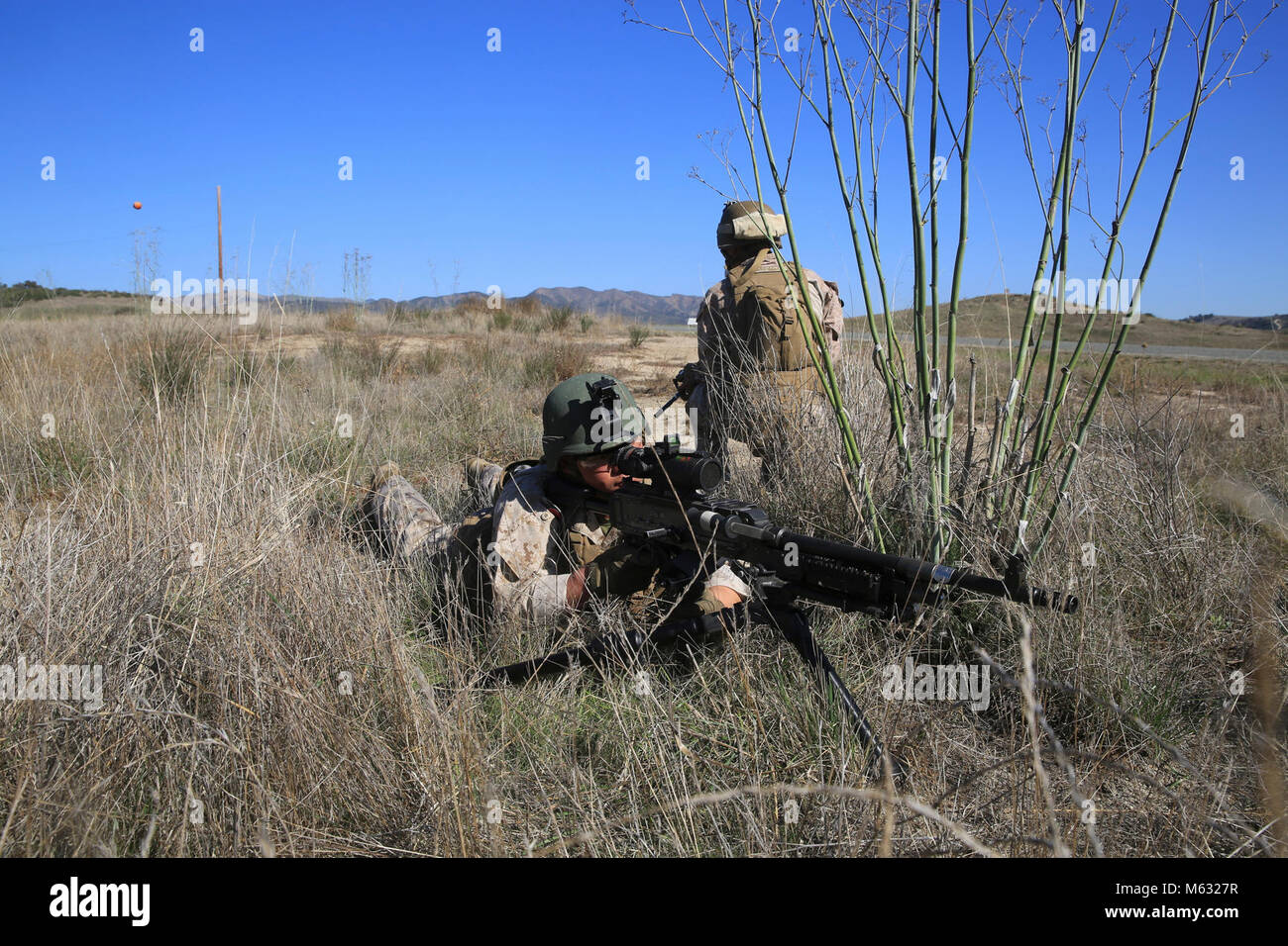 U.S. Marine Lance Cpl. Alexander Huynh, a machine gunner, and Pfc ...