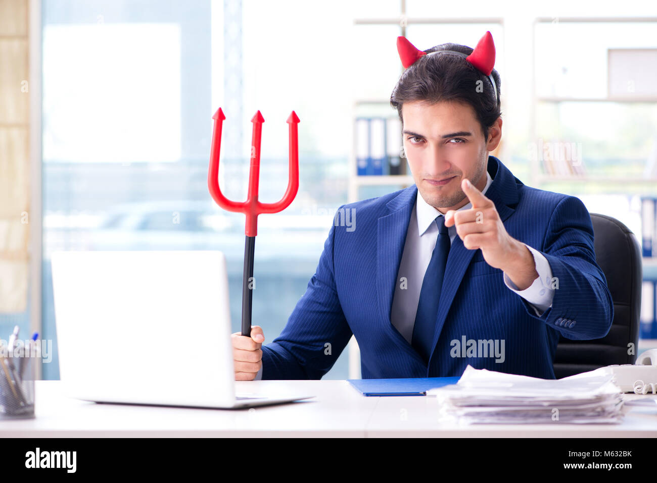 Devil angry businessman in the office Stock Photo - Alamy