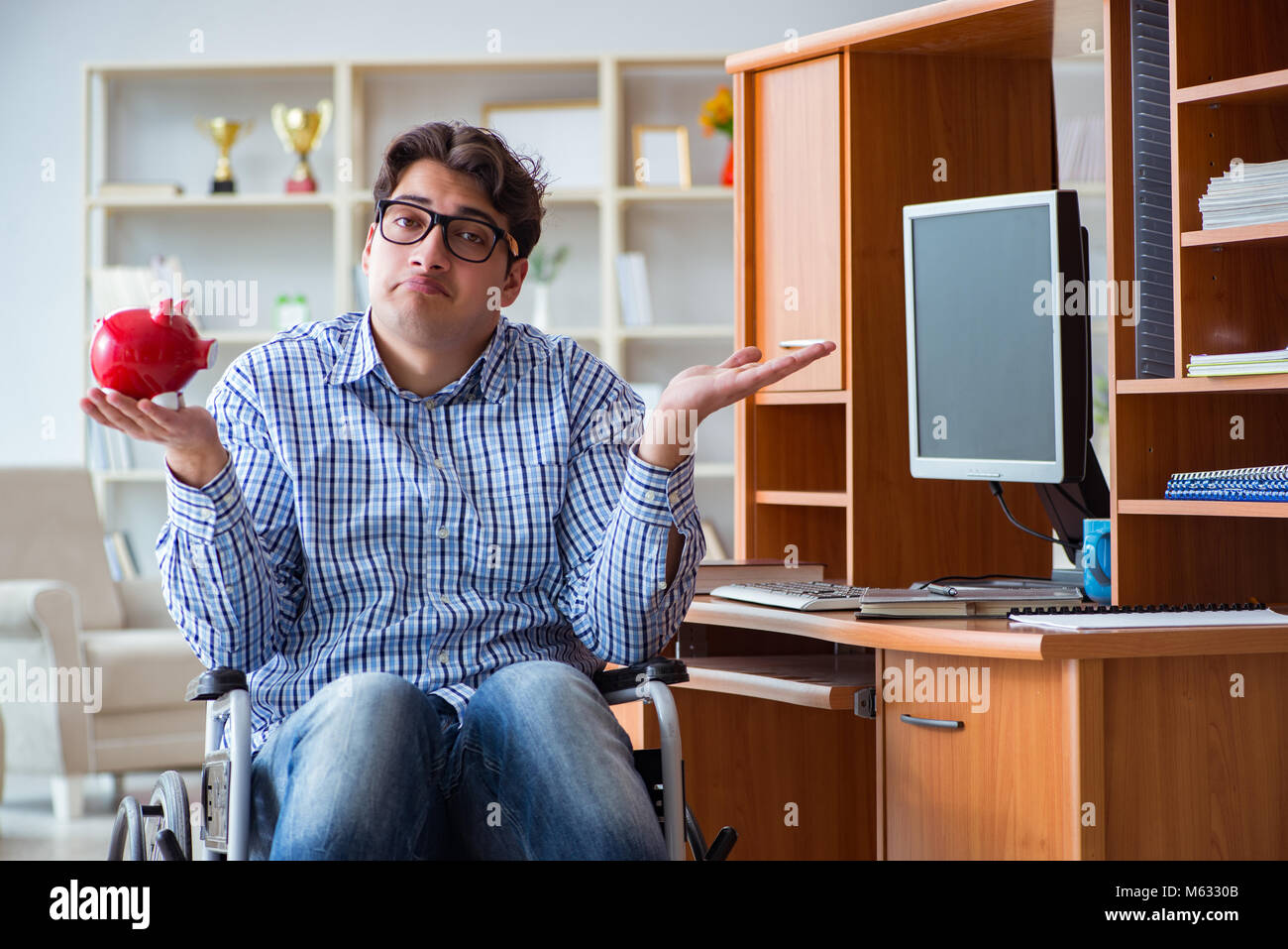 Disabled student studying at home on wheelchair Stock Photo - Alamy
