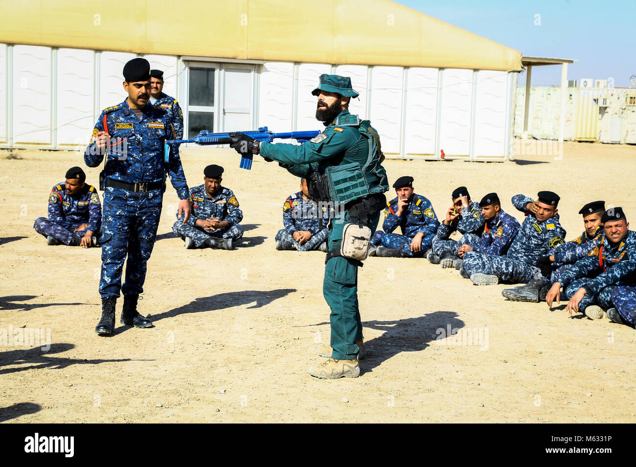 Iraqi Federal Police attached to the 1st Battalion, conduct a class on ...
