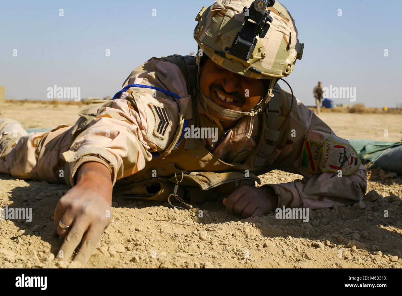 Soldiers attached to 3rd Battalion, 40th Brigade, Iraqi army, go over ...
