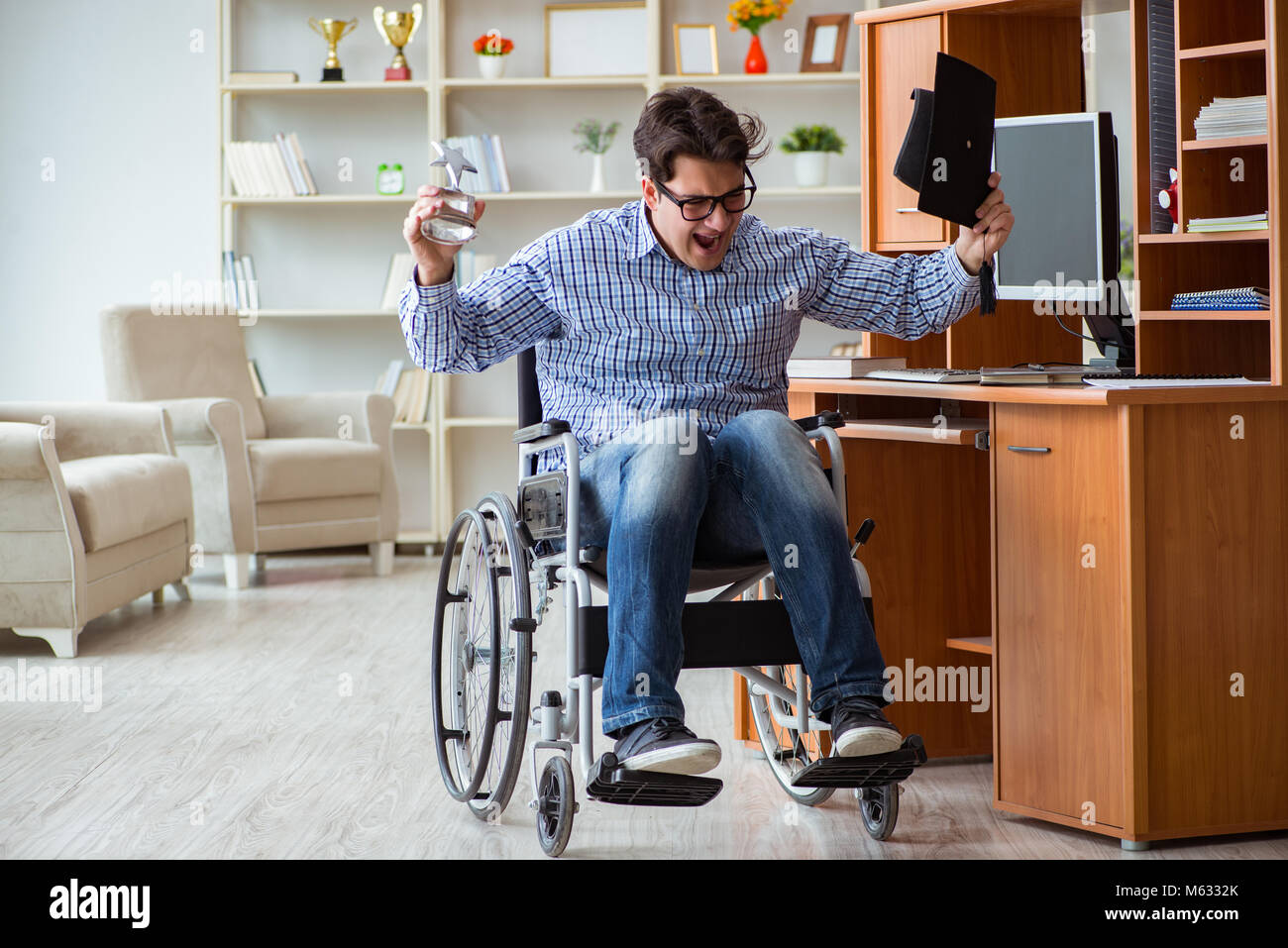 Disabled student studying at home on wheelchair Stock Photo - Alamy