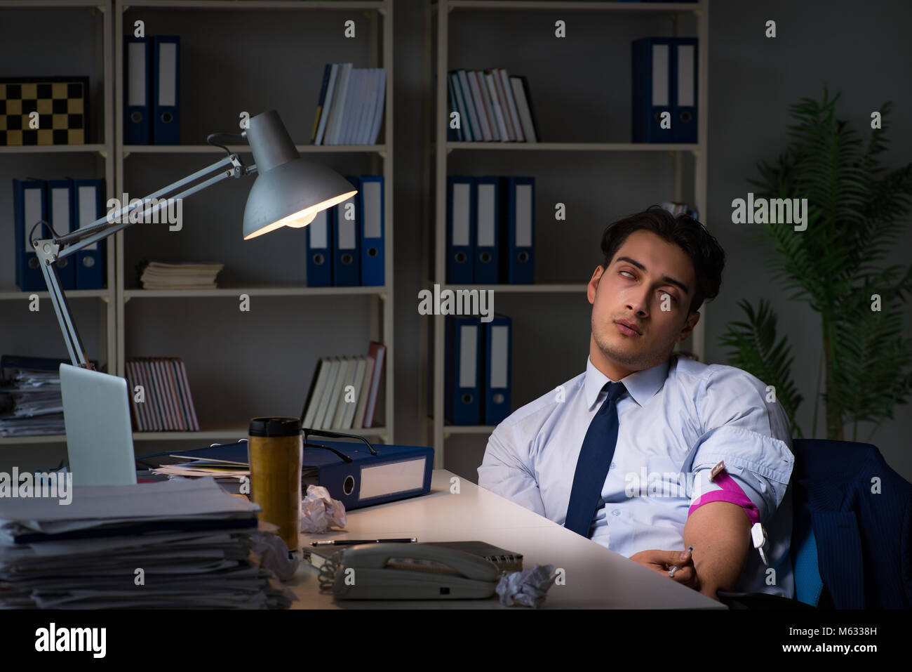 Employee relieving stress from overtime with drugs narcotics Stock ...