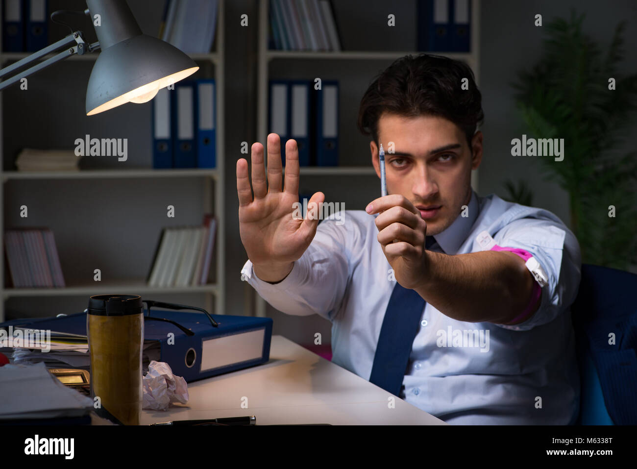 Employee relieving stress from overtime with drugs narcotics Stock ...