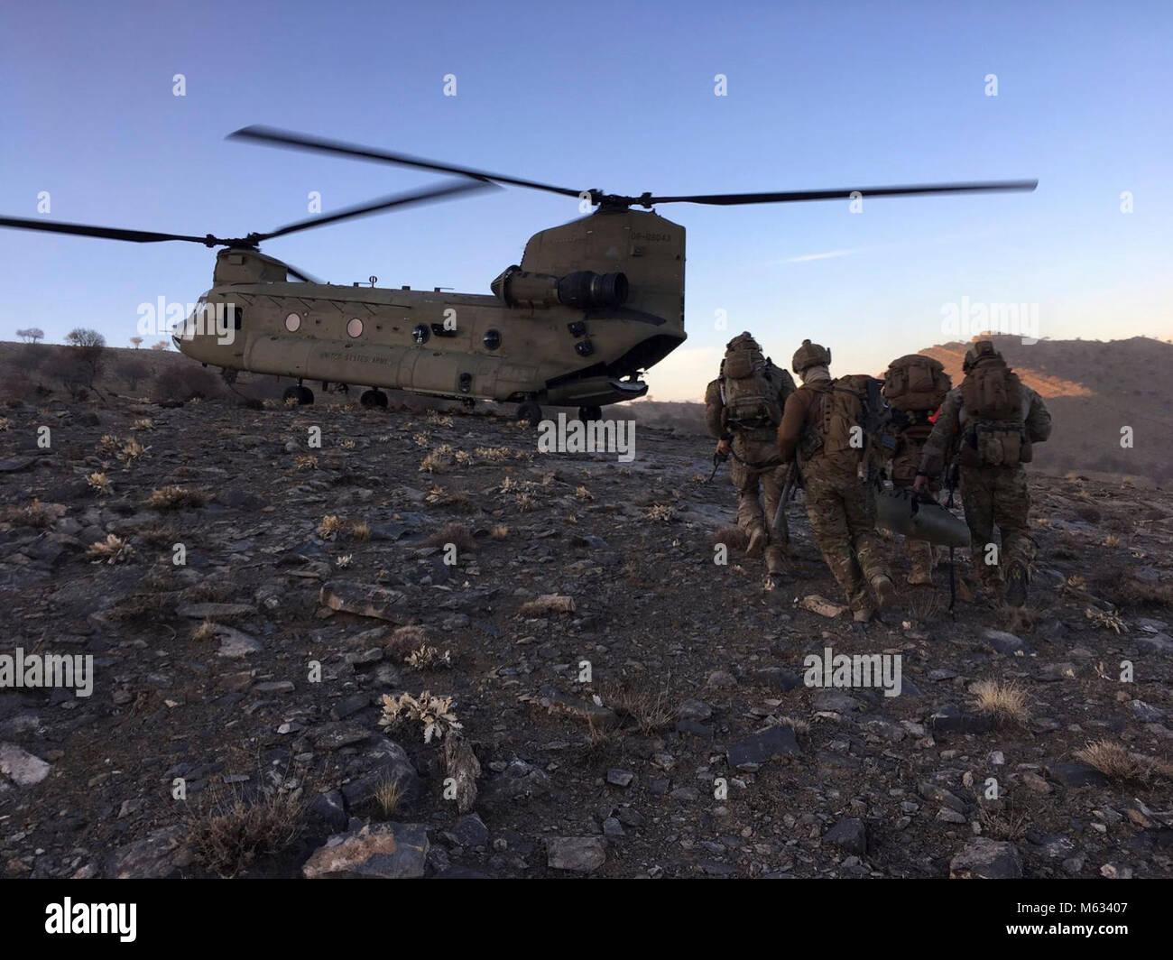 Members of the 83rd Expeditionary Rescue Squadron prepare to board a U ...