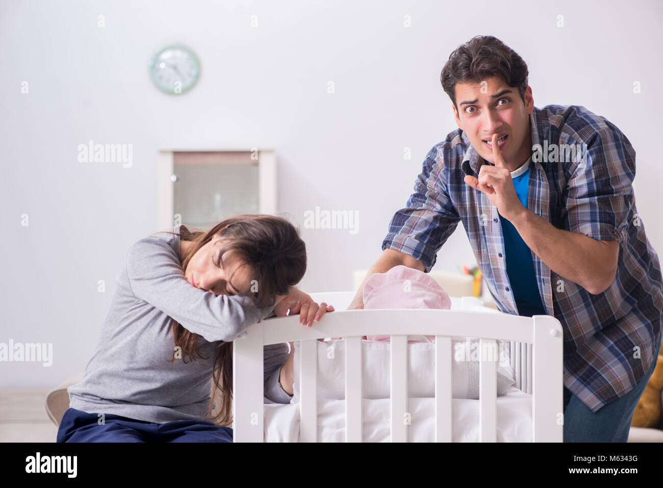 Young dad cannot stand baby crying Stock Photo - Alamy