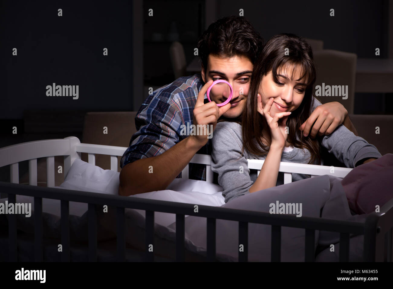 Young parents sleepless with newborn baby at night Stock Photo - Alamy