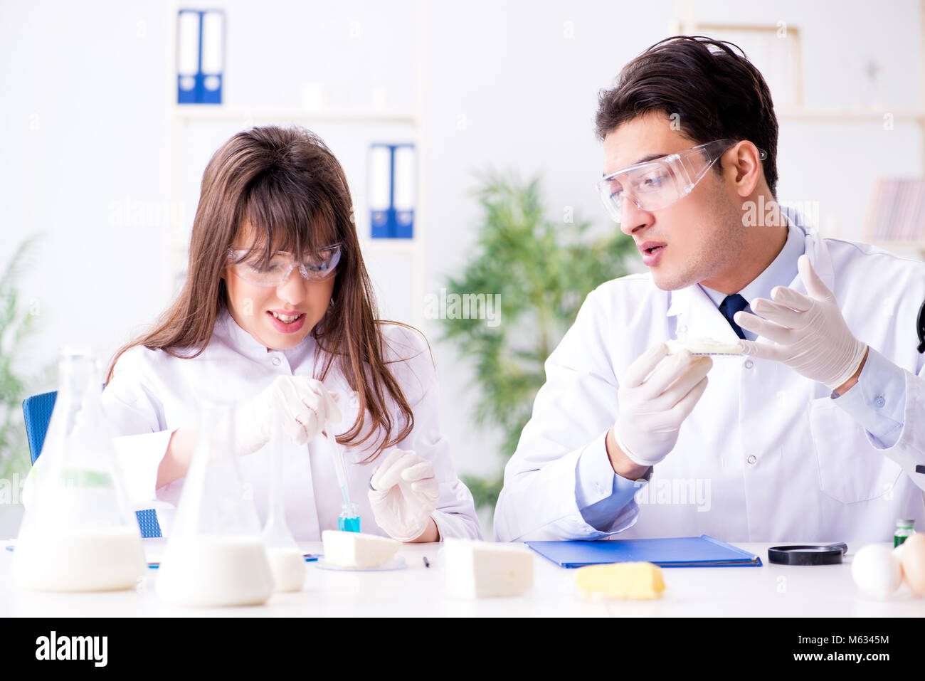 Two lab doctor testing food products Stock Photo - Alamy