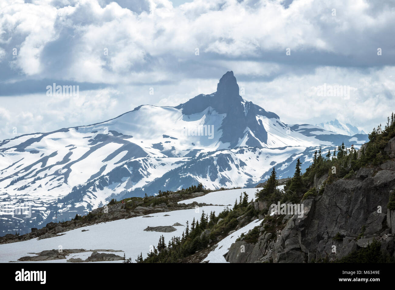 Canadian mountain range peak with summer snow melt Stock Photo - Alamy