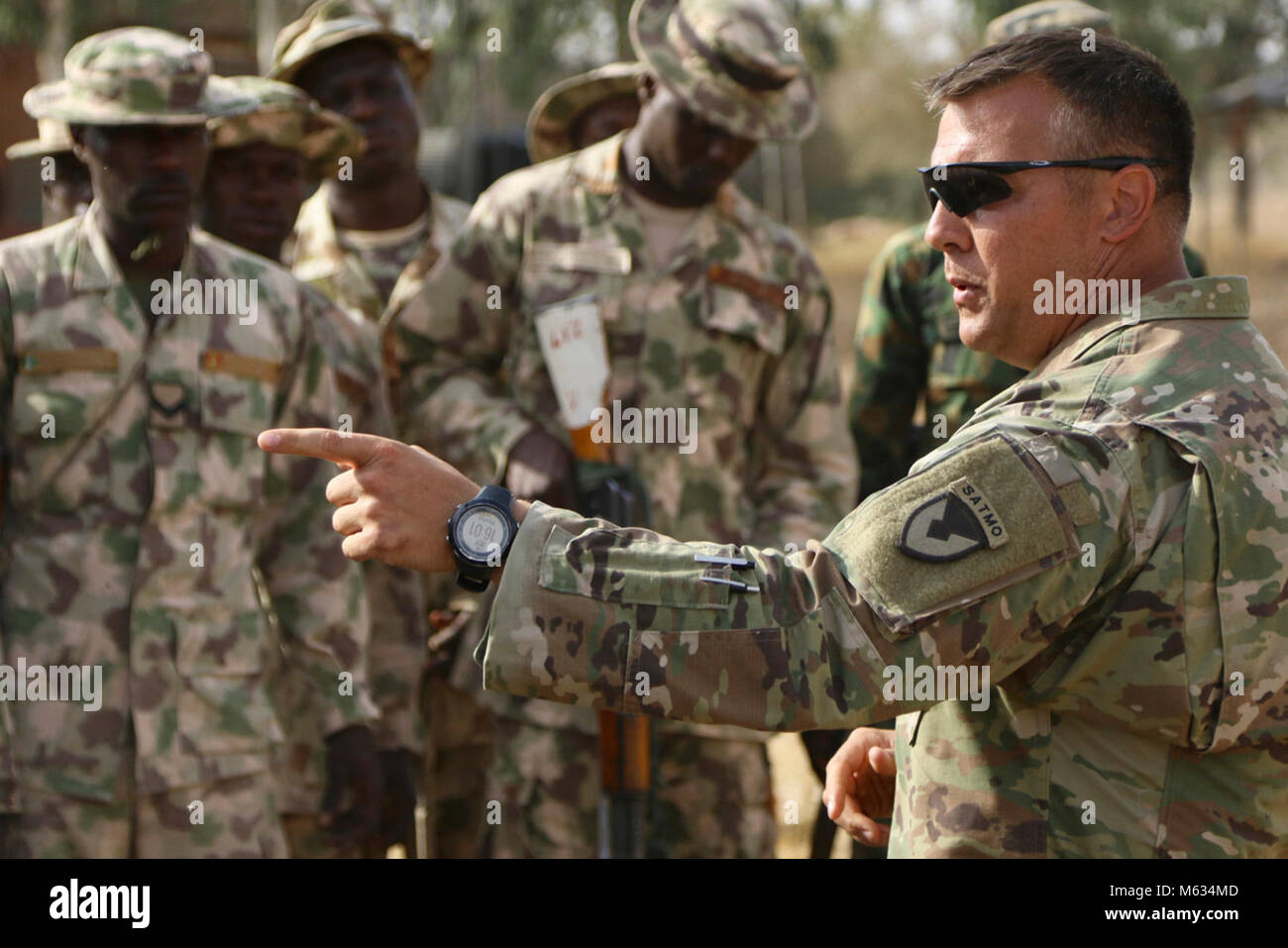 Twelve Soldiers U.S. Army Soldiers share tactics and training with a ...