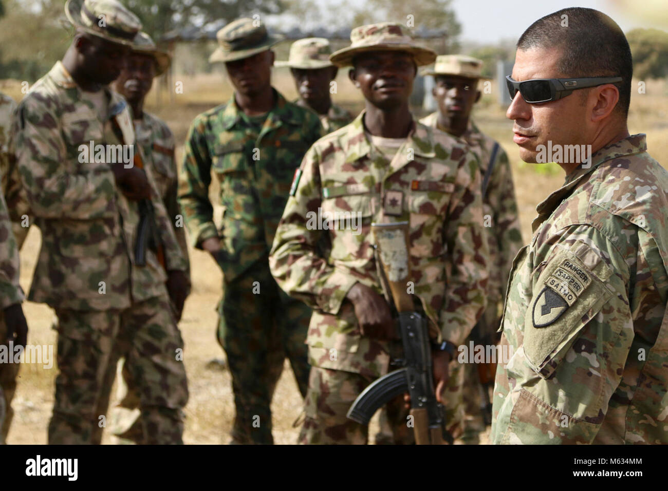 Twelve Soldiers U.S. Army Soldiers share tactics and training with a ...