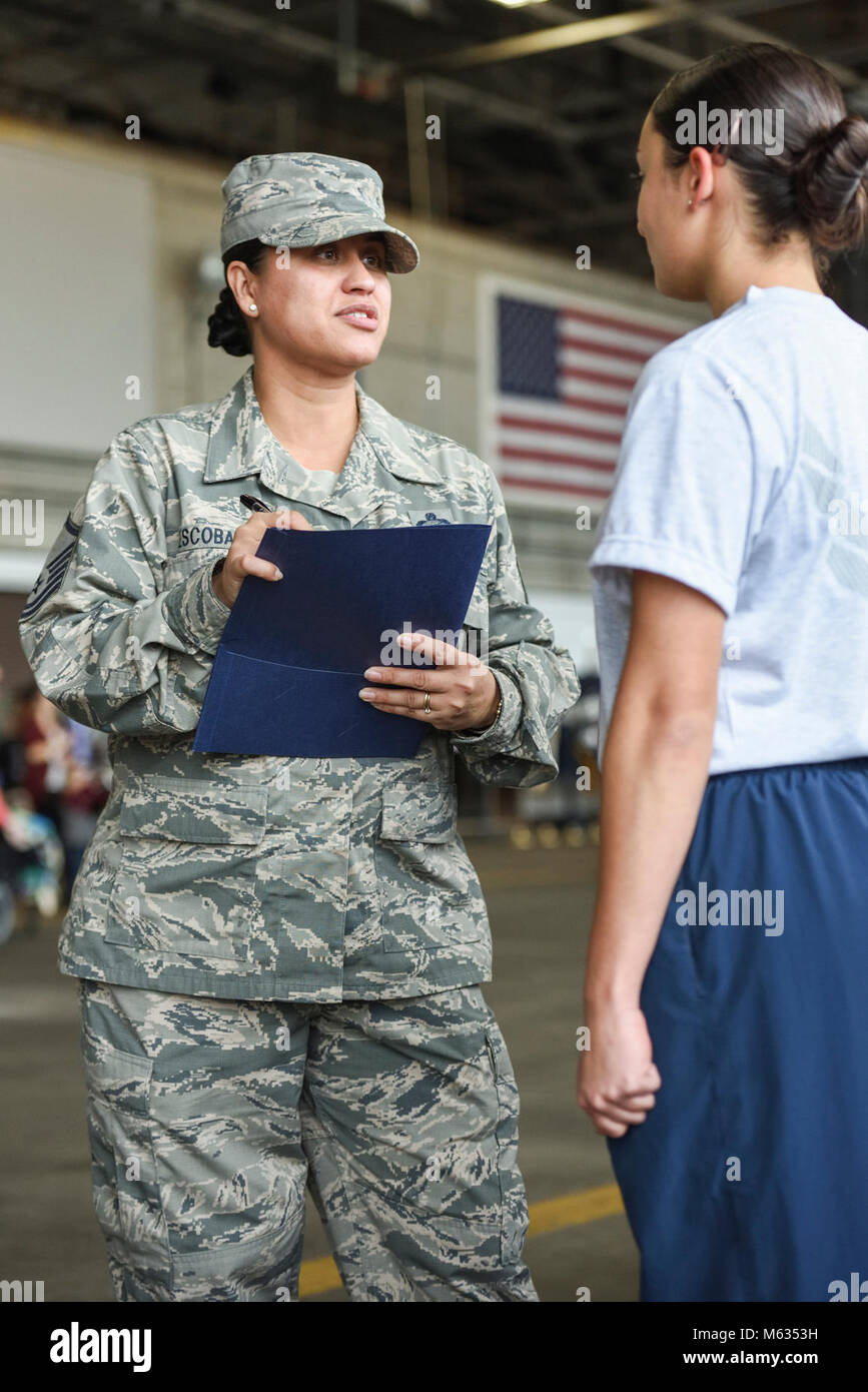 Master Sgt. Maria Escobar, 102nd Force Support Flight, provides ...