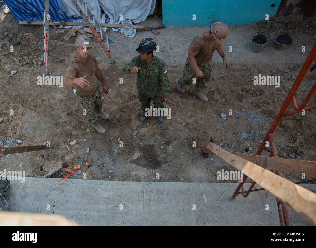 U.S. Navy Builder 1st Class, Corey Roberts, left, Naval Mobile ...