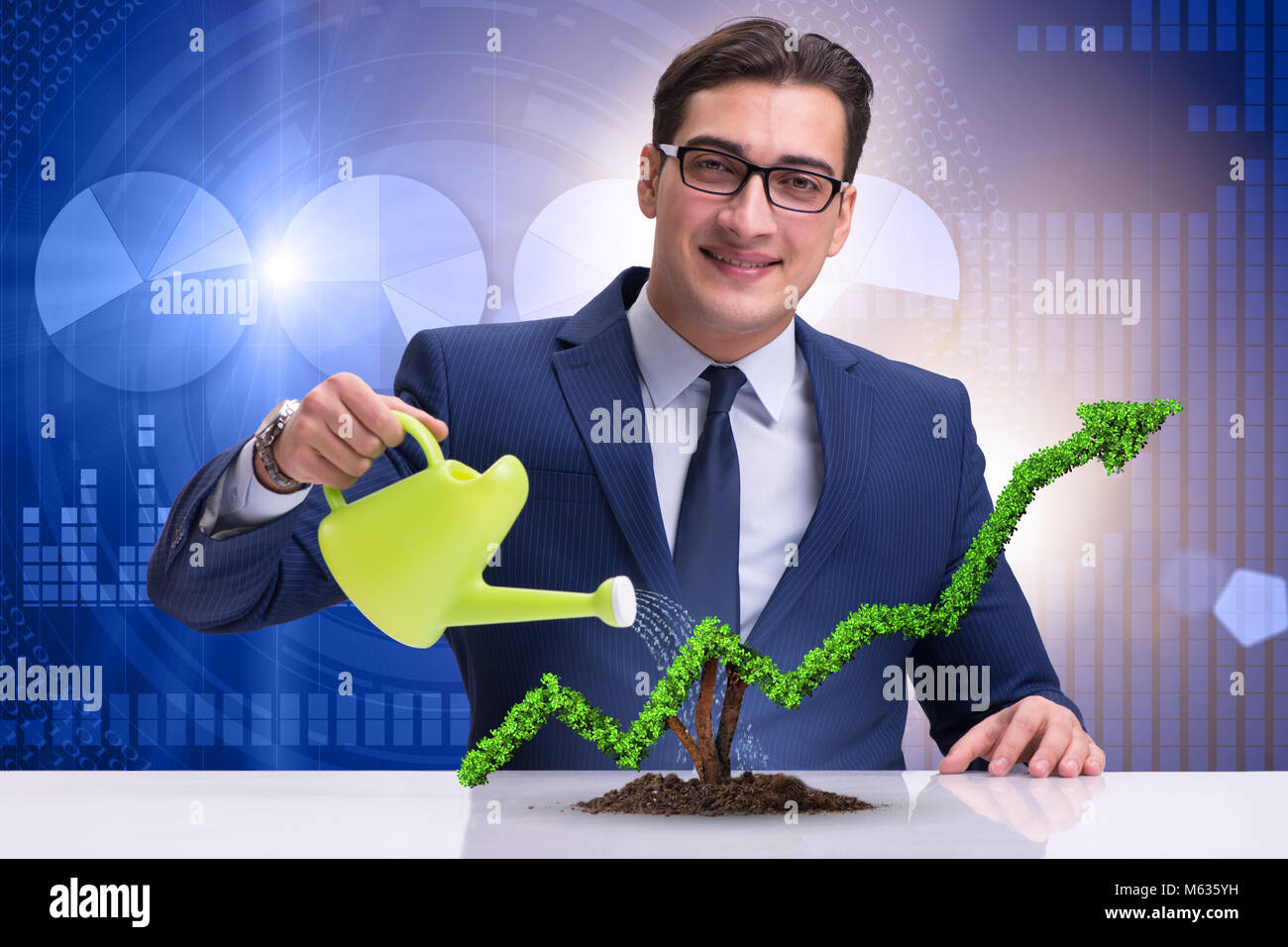 Businessman in investment concept watering financial line chart Stock ...