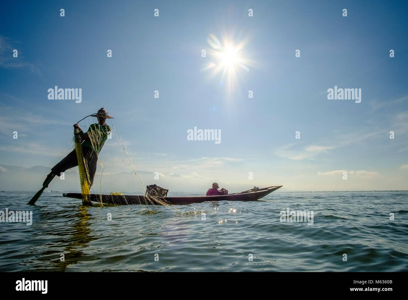 Fisherman paddle boat hi-res stock photography and images - Alamy