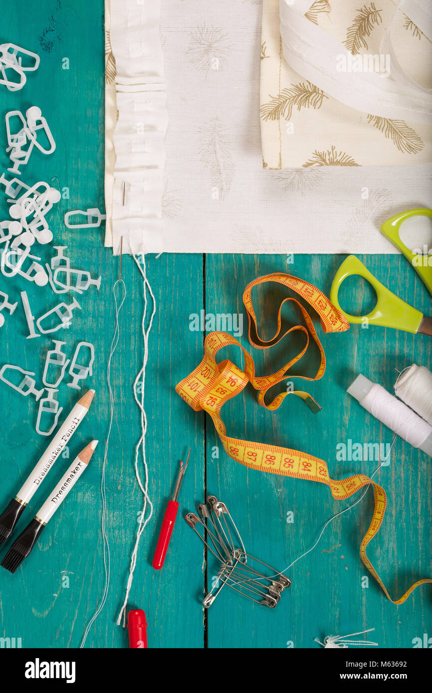 Process of attaching pleat tape to curtains. Top view Stock Photo - Alamy