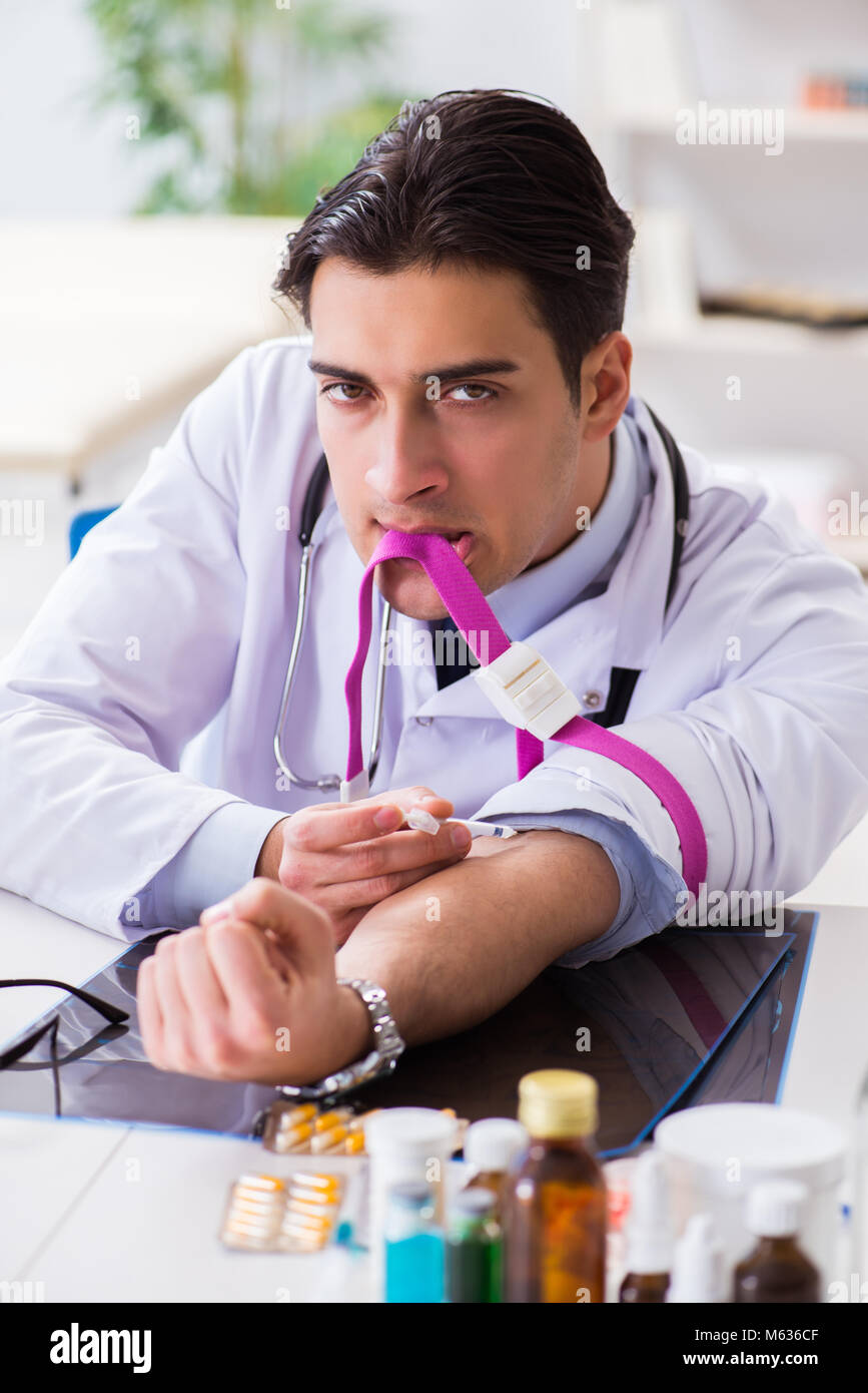 Doctor drug addict in the hospital Stock Photo - Alamy